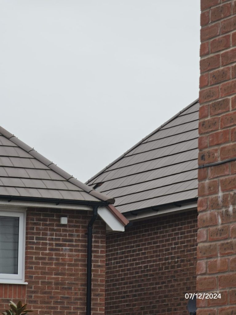 Falling slate roof tile repair on a detached home in Warrington - Local ...